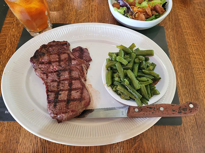 A steak so perfectly grilled it deserves its own Instagram account. Green beans provide color commentary to the main event.