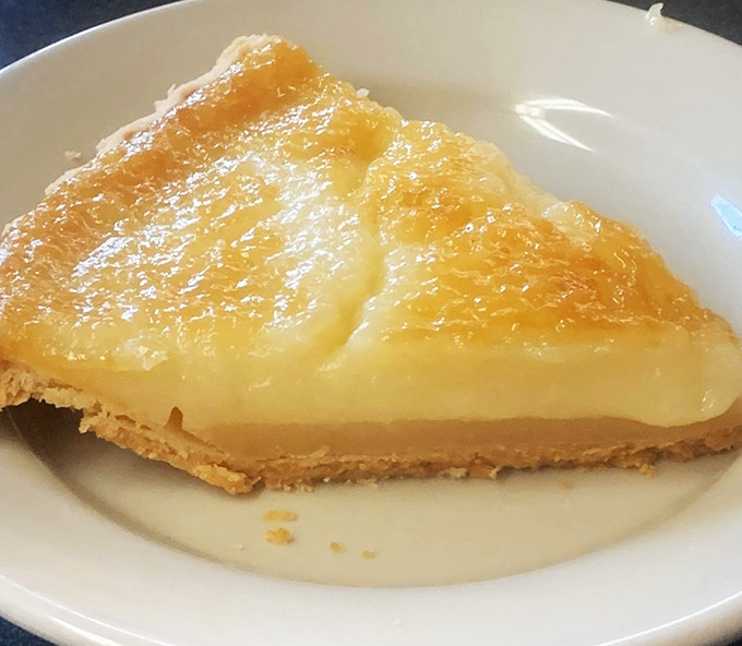 Sugar cream pie with its glistening, caramelized top is Indiana's official state pie for good reason. Simple ingredients transformed into pure magic.