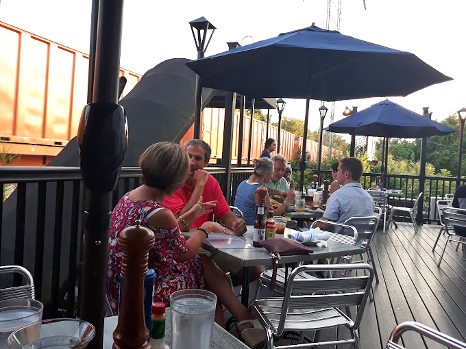 Summer evenings on the deck—where seafood tastes even better with a side of fresh air. Delaware dining at its most civilized.