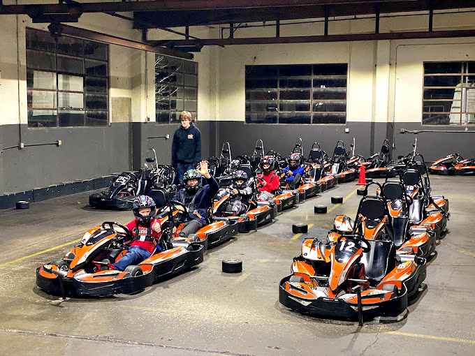 The pre-race lineup – a moment of anticipation before helmets go on and friendly trash talk reaches championship levels.