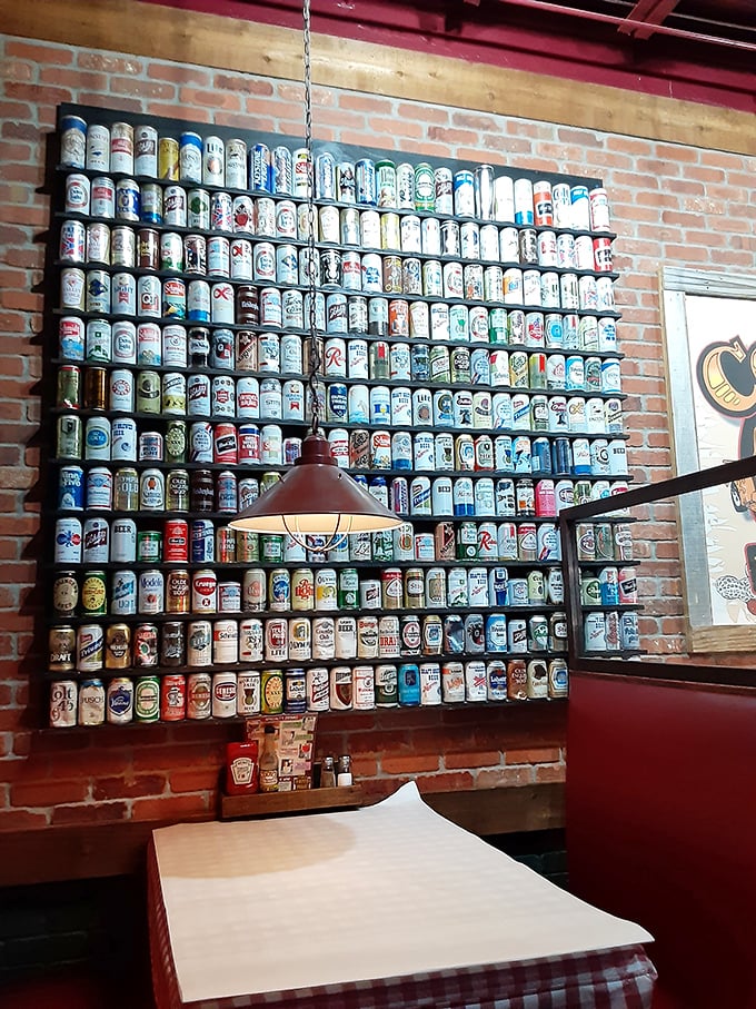 Beer can wall art that would make any collector weep with joy. It's like a museum exhibit dedicated to America's favorite pastime.