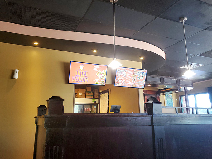 The humble counter where magic happens. Behind that wood paneling lies the secret geography of flavor that keeps locals coming back.