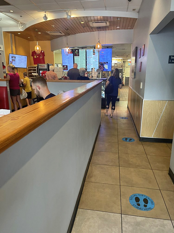 The lunch counter ballet – where regulars and first-timers alike line up for their slice of comfort in a chaotic world.