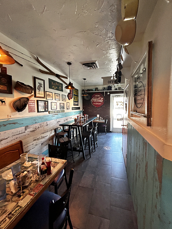 The narrow hallway of nostalgia &ndash; where Coca-Cola signs and weathered wood paneling create the perfect atmosphere for coffee and conversation.