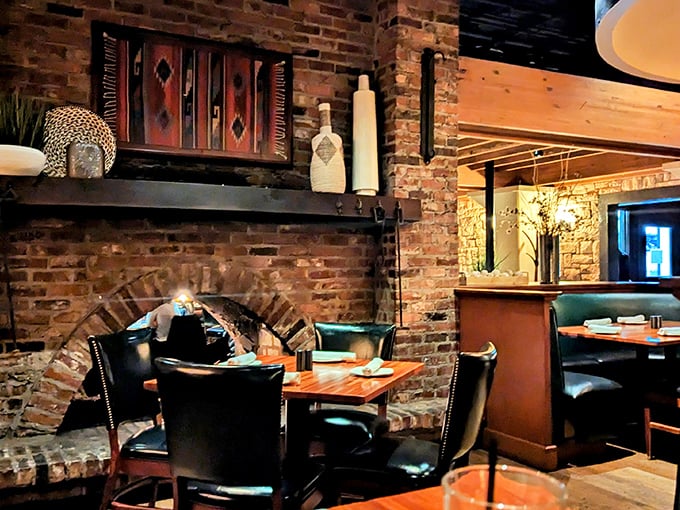 Exposed brick and thoughtful decor create dining nooks that feel both intimate and important. Like dining in a sophisticated cave.
