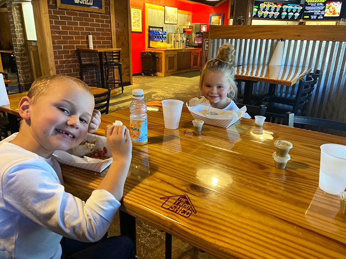 Young food critics giving their enthusiastic approval. Those smiles say more about the quality than any Michelin inspector ever could.