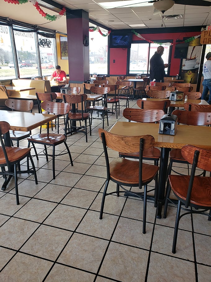 The unassuming dining room where strangers become friends, united by the universal language of "mmm" and "pass the salsa."