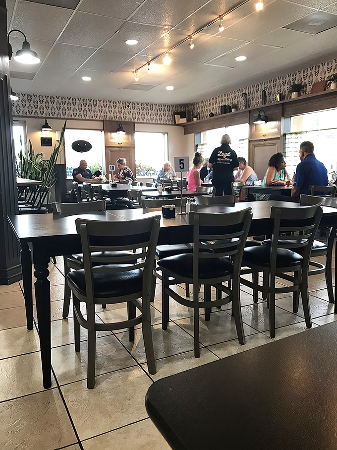 A bustling dining room where strangers become friends over shared appreciation of exceptional food. The best conversations happen when everyone's taste buds are happy.