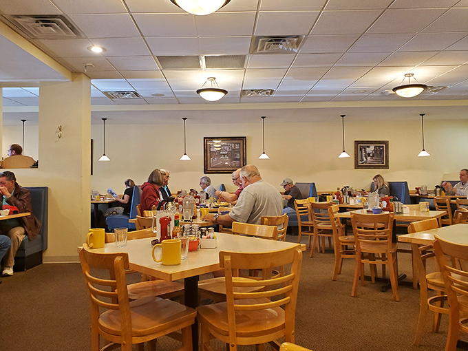 The dining room hums with the satisfaction of people who've made the right breakfast decision&mdash;yellow mugs standing ready for coffee refills.