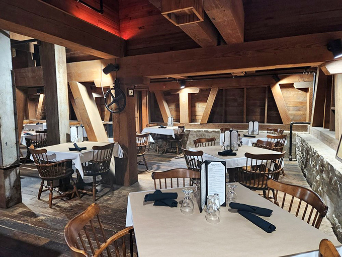 Wooden beams frame this dining area like a Bavarian postcard, where every table promises a memorable meal in historic surroundings.