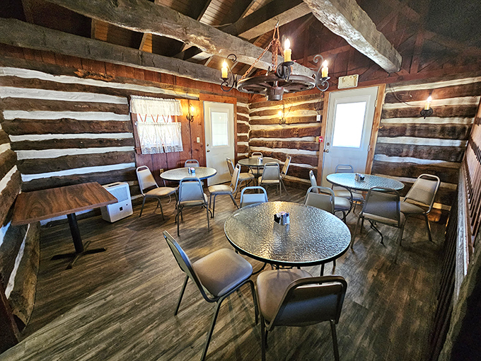 Log cabin dining that makes you want to trade your smartphone for a butter churn. These walls have heard more dinner conversations than a family therapist.