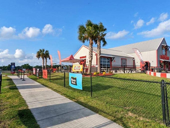 Palm trees and racing flags welcome speed seekers to their playground. The facility's clean design and well-kept grounds hint at the professional experience inside.