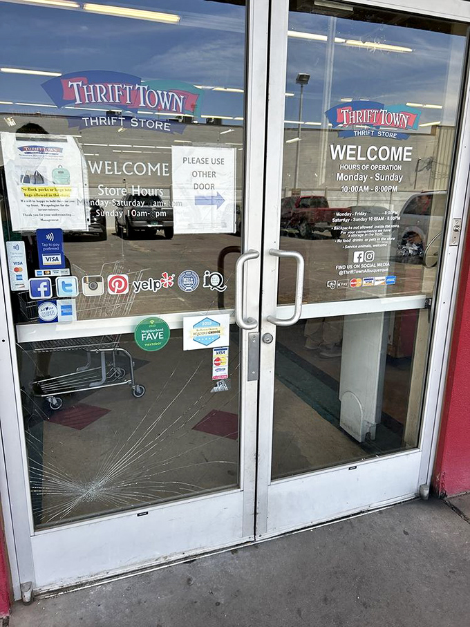 The entrance beckons with promises of treasures within. That cracked glass is just part of the authentic thrift experience!