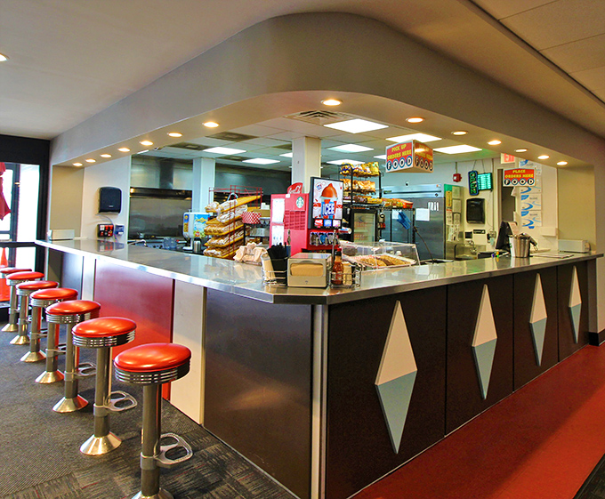The diner counter with its diamond pattern mimics the building's exterior - mid-century design consistency at its finest.