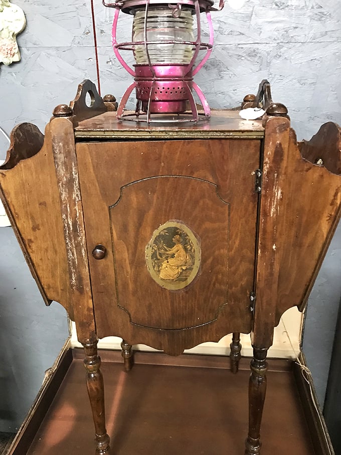 This antique cabinet with its weathered finish and decorative medallion tells stories that IKEA's instruction manuals never could.