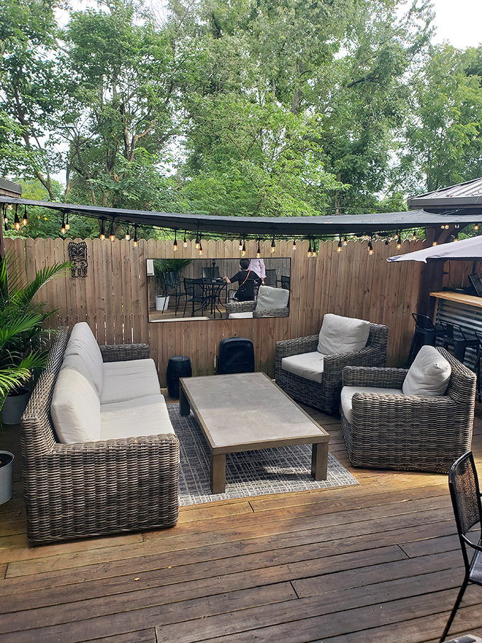 The outdoor lounge doesn't just offer seating&mdash;it offers sanctuary. String lights overhead creating the ambiance that Instagram filters desperately try to replicate.