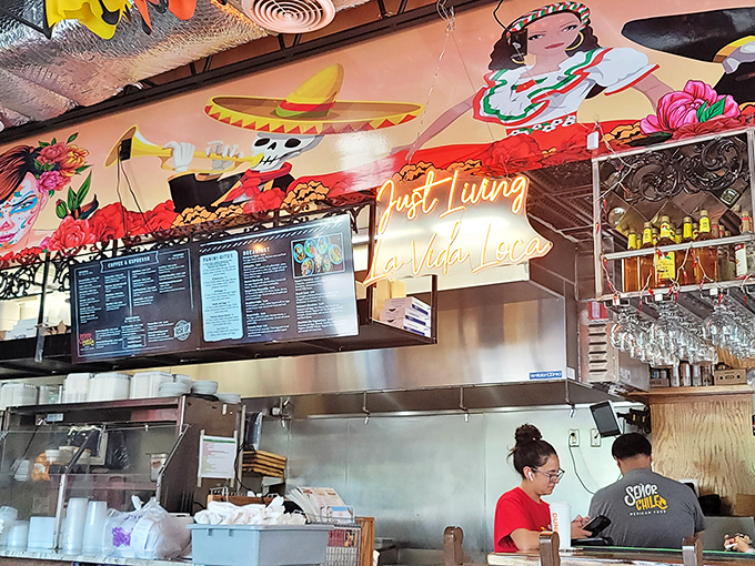 "Just Living La Vida Loca" glows in neon above busy staff members. Truth in advertising has never been so appetizing.