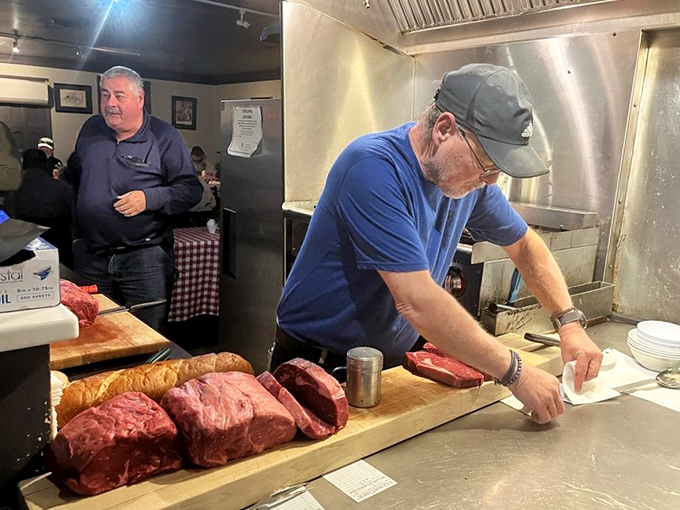 The maestros at work, transforming premium beef into life-changing meals with surgical precision and practiced care.