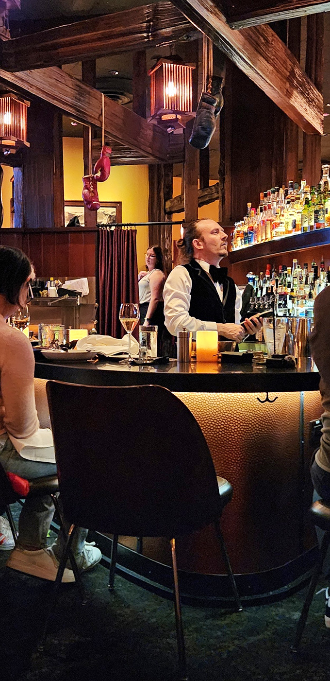 Behind the bar, liquid artistry unfolds under vintage beams&mdash;where classic cocktails are built with precision and served with a smile.