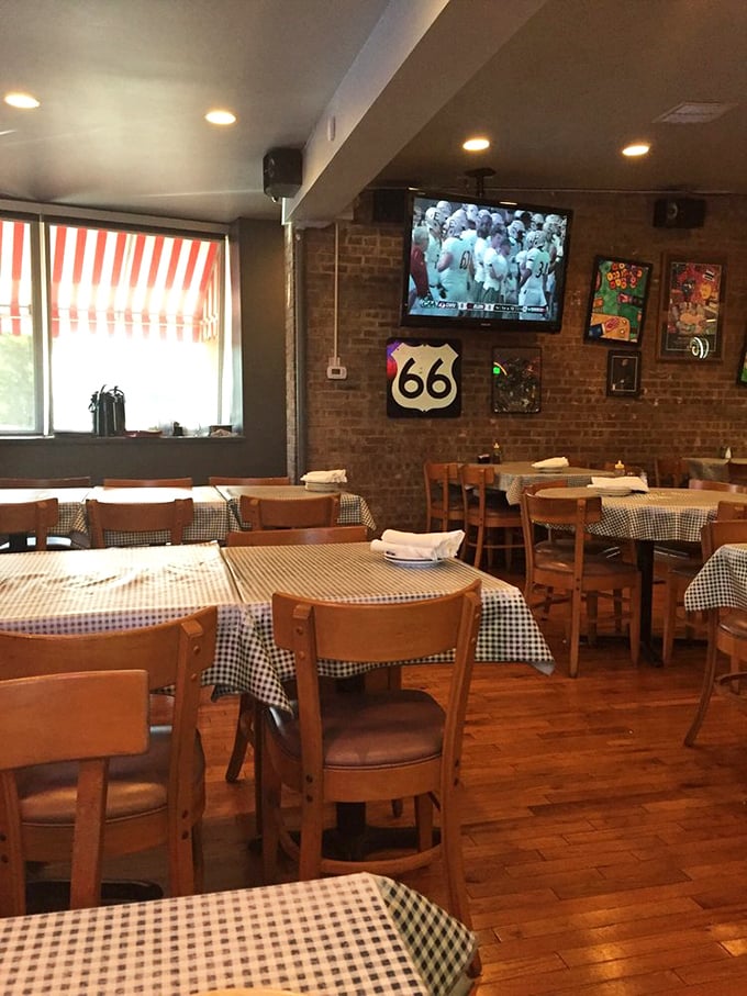 Wooden chairs, brick walls, and Route 66 signs create the perfect backdrop for comfort food indulgence. The TV ensures you won't miss the game while savoring your chicken.