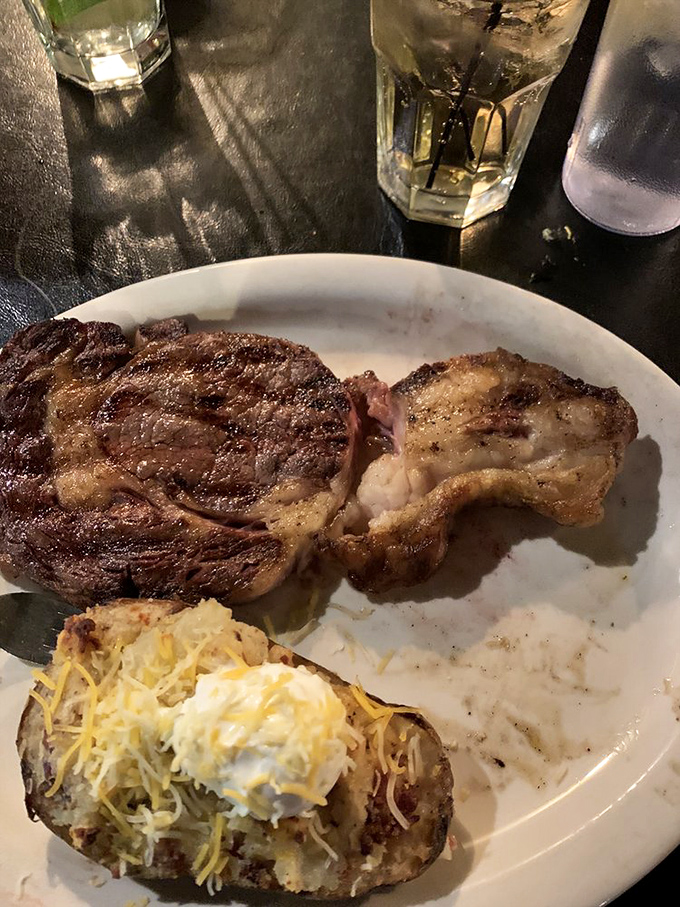 The ribeye doesn't merely sit on the plate&mdash;it commands it, with a side of potato that's been loaded like it's preparing for winter.