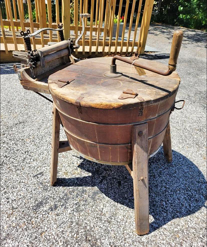 Laundry day's mechanical ancestor sits proudly in the sun. This wooden washing machine reminds us when "spin cycle" meant actual physical labor and Monday was universally dreaded.