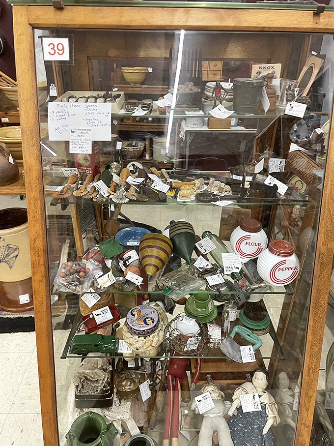Glassware and ceramics arranged like a museum of everyday life. Each piece survived decades of dinner parties and holiday gatherings.