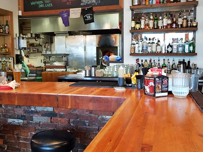 The bar area&mdash;where wood, brick, and bottles create the perfect backdrop for decisions like "Another beer?" (The answer is always yes.) 