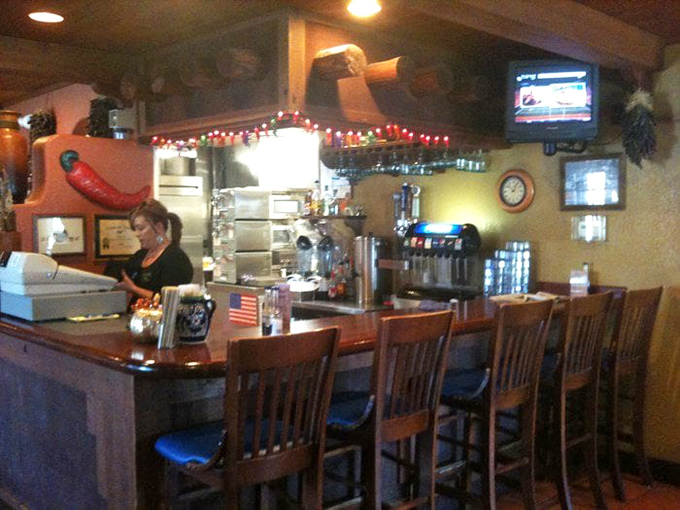 The bar area: where strangers become friends over margaritas and chip baskets that somehow empty themselves when nobody's looking.