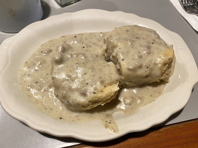 These biscuits aren't just smothered in gravy&mdash;they're completely surrendered to it, waving the white flag of breakfast bliss.