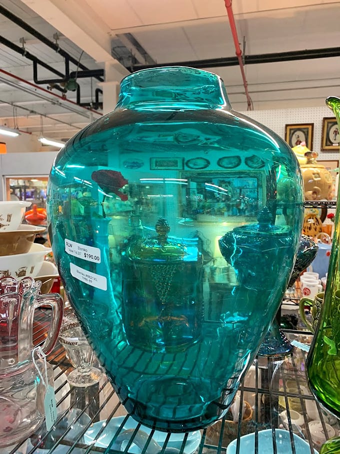 This stunning turquoise Blenko glass vase captures light like a Caribbean lagoon. Mid-century craftsmanship that puts modern decor to shame.