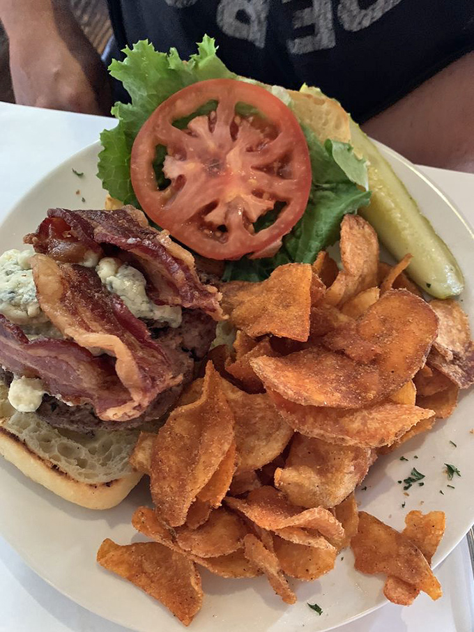 This burger isn't just a meal, it's an event. Those house-made chips are the loyal sidekicks every heroic sandwich deserves.