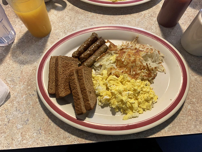 The classic American breakfast plate: where eggs, hash browns, sausage, and toast gather for their daily meeting of the minds.