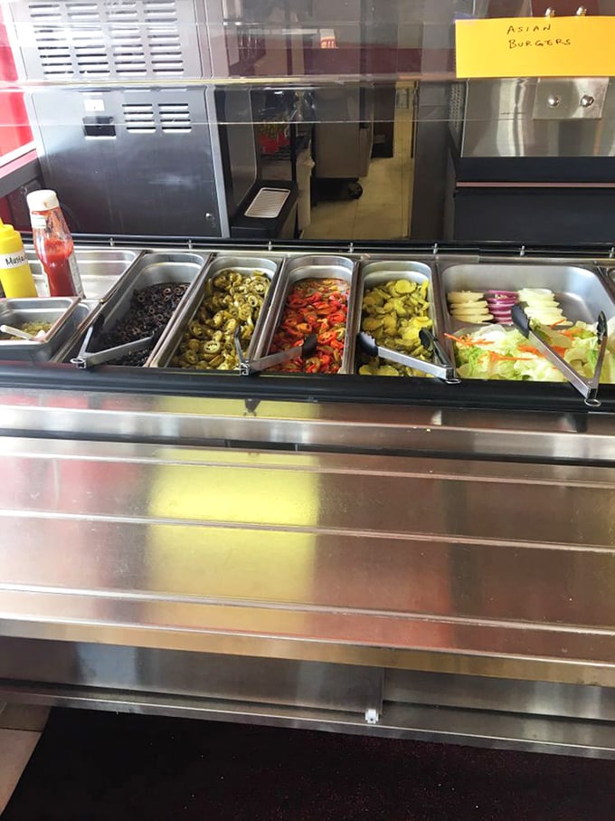 The condiment station stands ready to customize your creation, proving that sometimes the best luxury is having things exactly the way you want them.