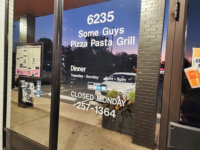 Business hours posted clearly&mdash;including that crucial "Closed Monday" warning. Plan accordingly or face a week of pizza disappointment.