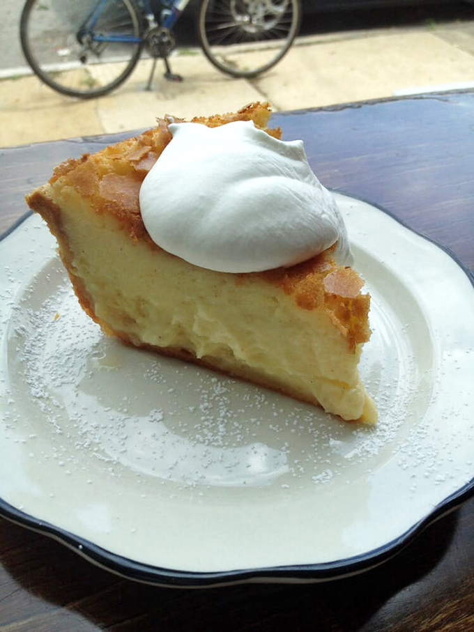 Buttermilk pie with a cloud of whipped cream&mdash;Southern comfort in slice form. The kind of dessert that makes you close your eyes with each bite.