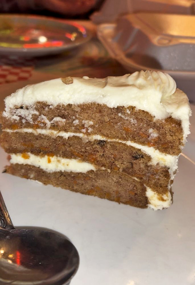 Carrot cake that looks like it was baked by someone's grandmother who really, really loves you and wants you to be happy.