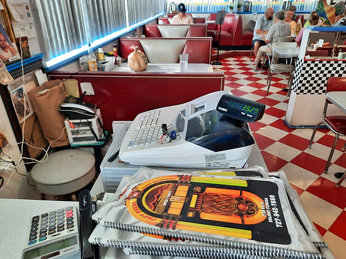 Where modern technology meets vintage vibes. The cash register area&mdash;complete with jukebox-themed order books&mdash;is command central for this time-traveling culinary experience.