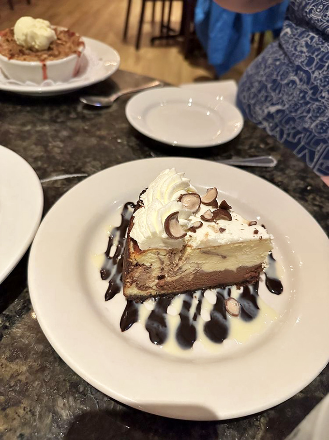 Cheesecake drizzled with chocolate sauce—because sometimes the answer to "Should I have dessert?" is "Obviously, yes!"