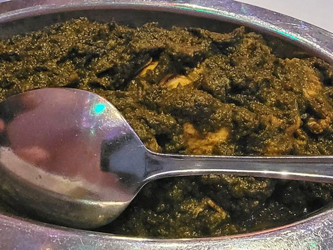 Saag paneer that looks like it could tell stories&mdash;creamy spinach hiding tender cheese in a rich, herb-infused embrace.