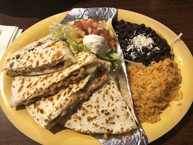Quesadillas that don't mess around—crispy, cheesy, and substantial enough to make you cancel dinner plans. The perfect balance of textures on a sunny yellow plate.