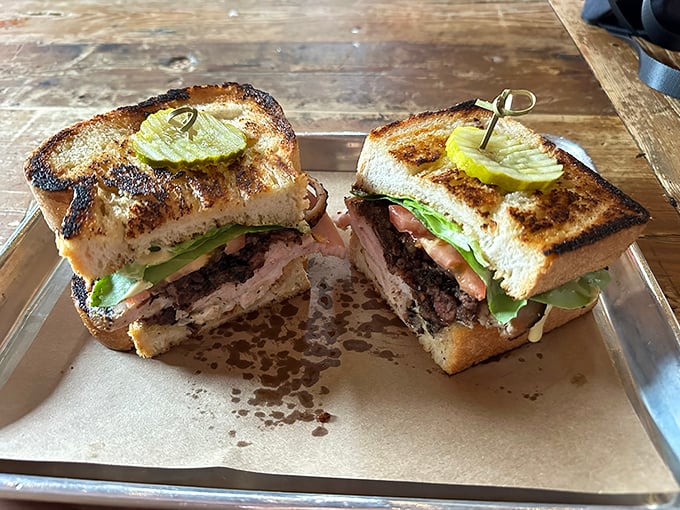 This sandwich isn't just assembled; it's architected &ndash; layers of smoke-kissed goodness demanding to be devoured with reckless abandon.