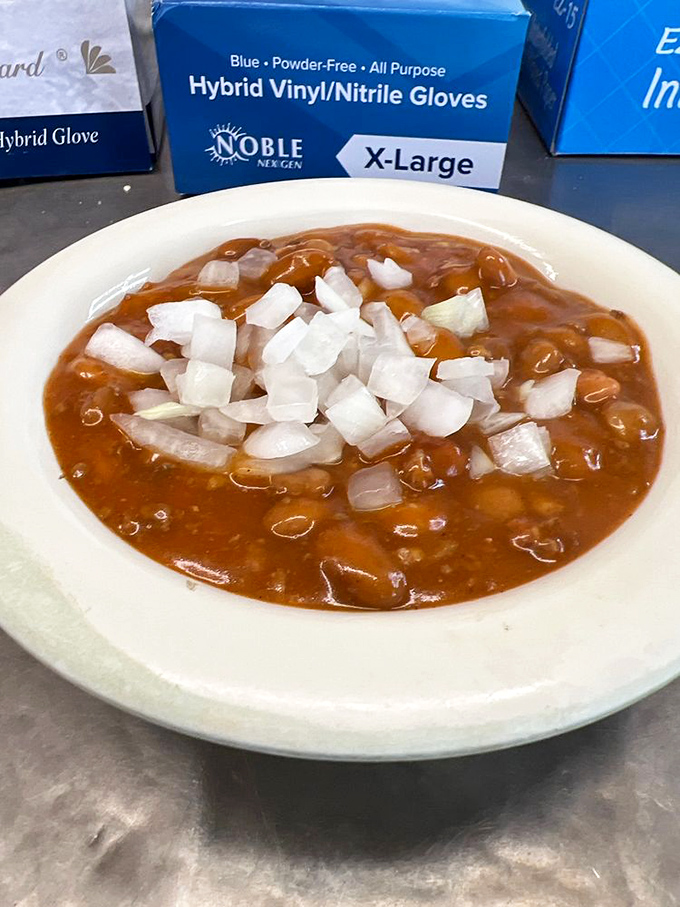 A bowl of their signature chili with diced onions on top. Simple, hearty, and exactly what your grandmother would prescribe for whatever ails you.