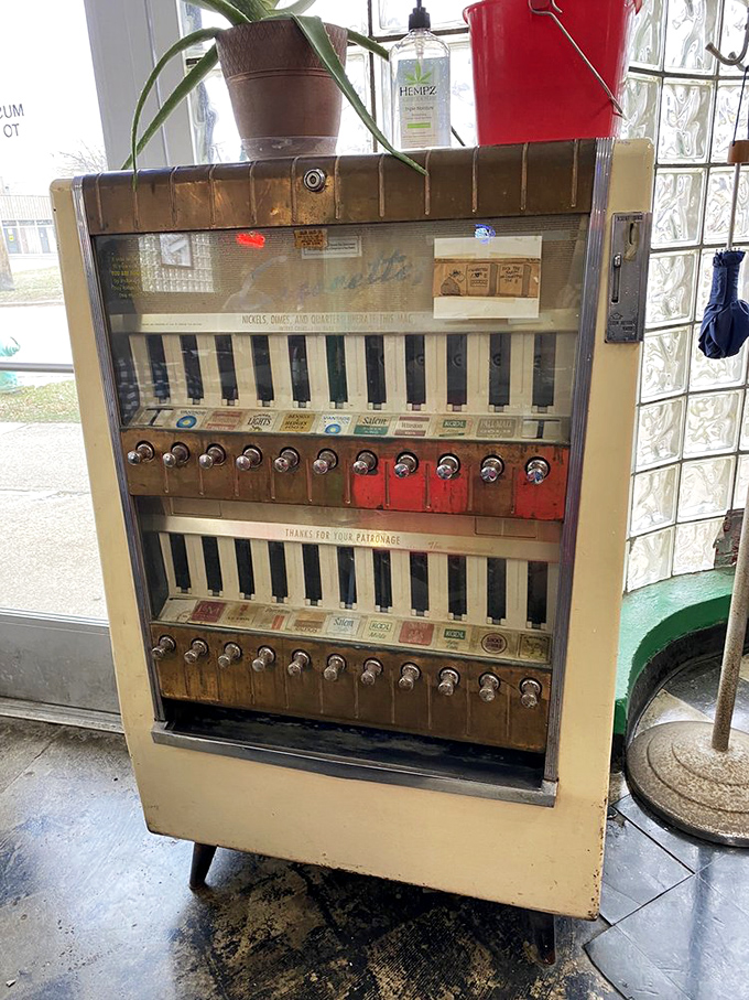 A vintage cigarette machine stands as a museum piece from another era. When dining out was simpler but the flavors just as complex.