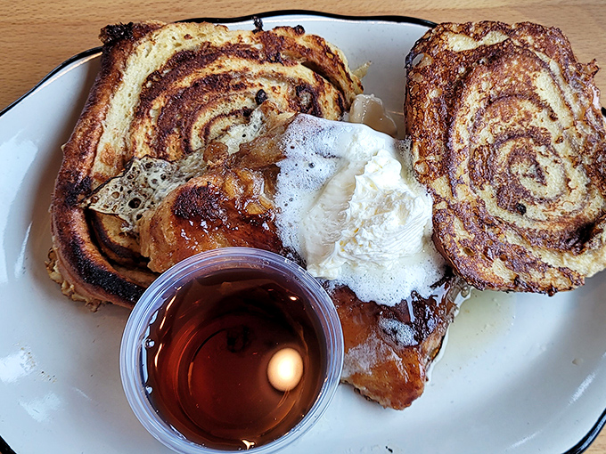 This isn't just breakfast&mdash;it's edible art. A pancake that spans the entire plate, with butter melting into a golden canvas of morning perfection.