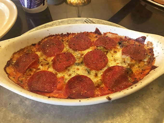 This crustless pizza creation proves that thinking outside the box sometimes means thinking inside the dish.