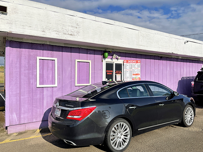 The purple building's modest exterior belies the flavor explosions happening inside. Don't judge this barbecue book by its cover.
