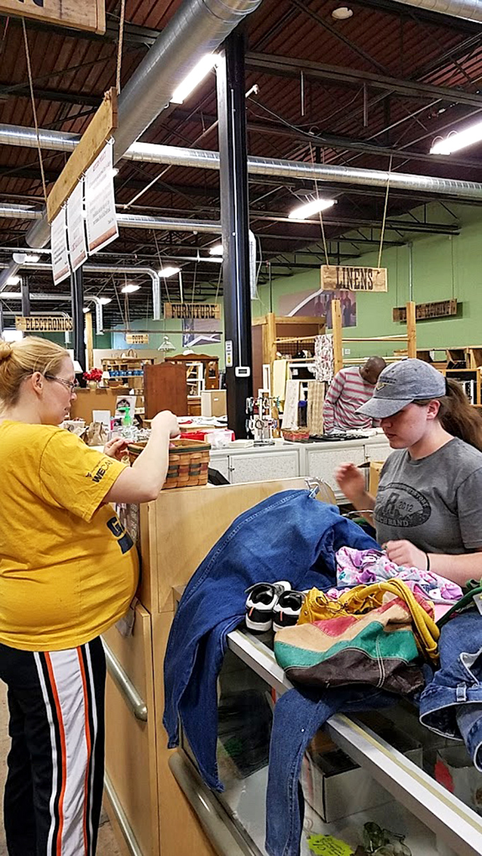 The checkout experience: where bargain hunters and friendly staff complete the thrifting circle of life. Every purchase tells a story.