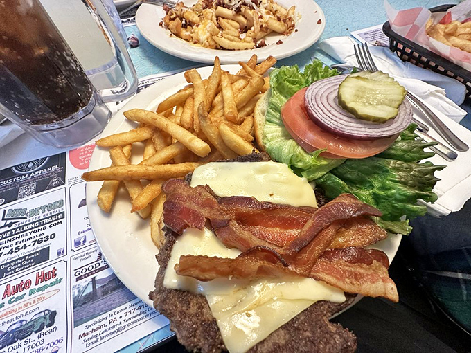 This isn't just a burger&mdash;it's a towering monument to the art of excess, where bacon and cheese unite in perfect harmony. 