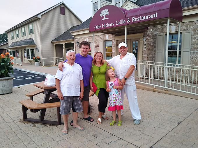The restaurant exterior with its burgundy awning serves as a landmark for hungry travelers. A gathering spot where families create memories one meal at a time.